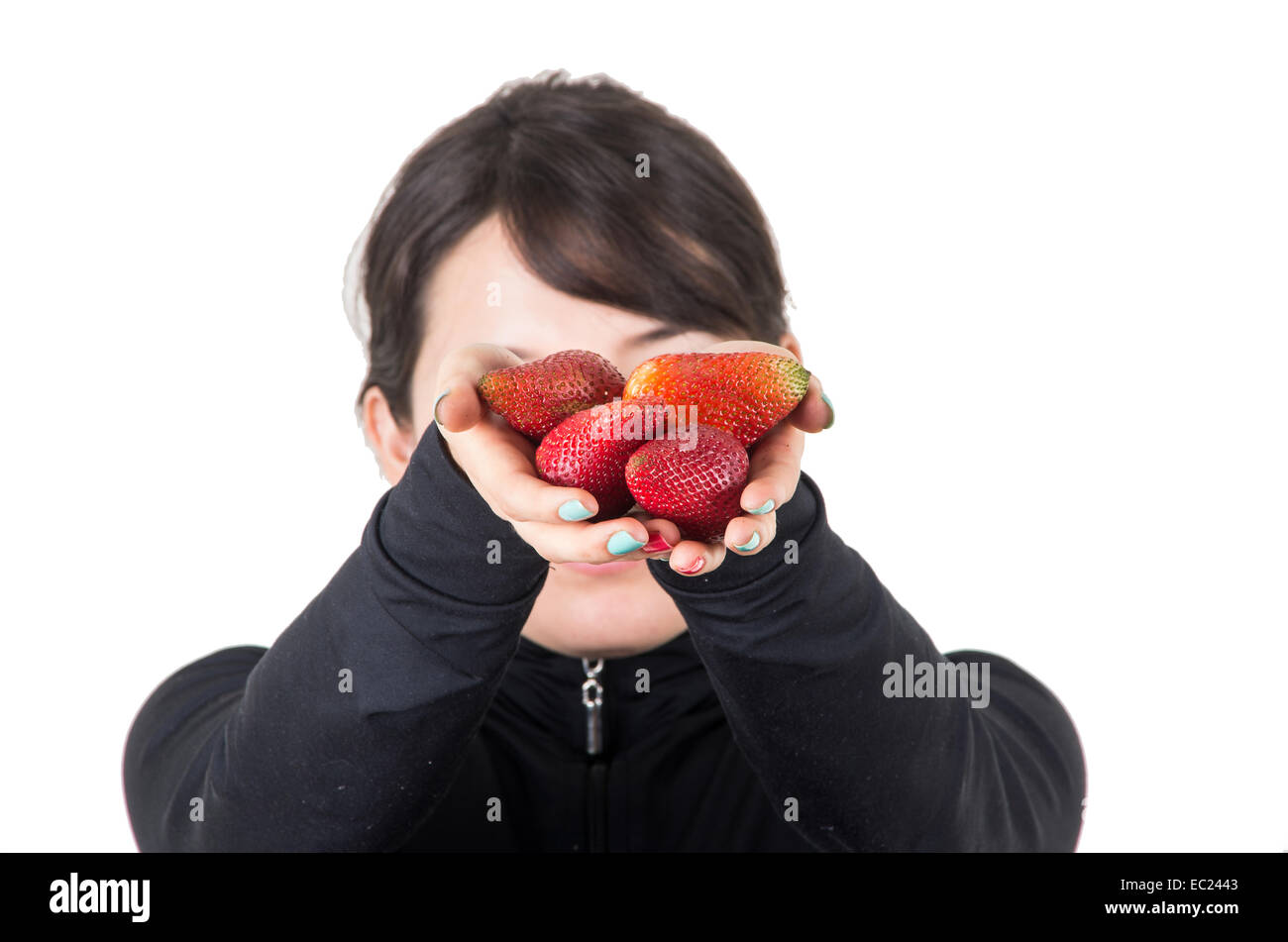 closeup portrait young girl offering red strawberries Stock Photo - Alamy