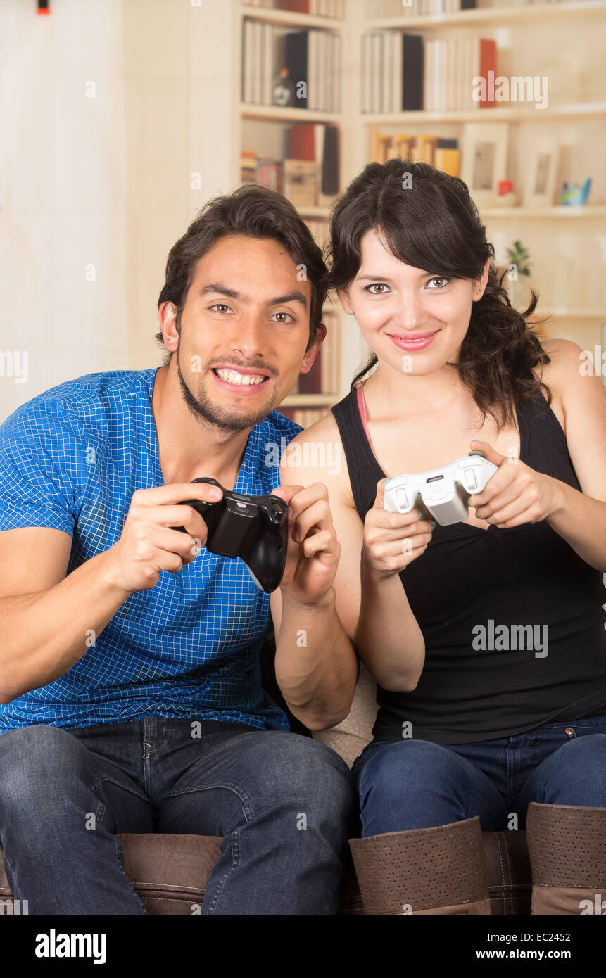 young cute couple playing video games Stock Photo - Alamy