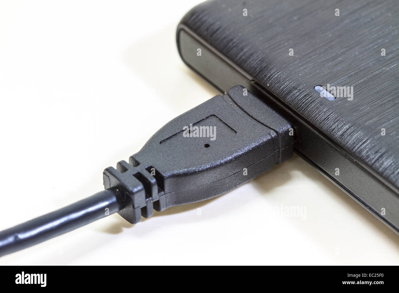 External hard drive with usb cable on white Stock Photo - Alamy