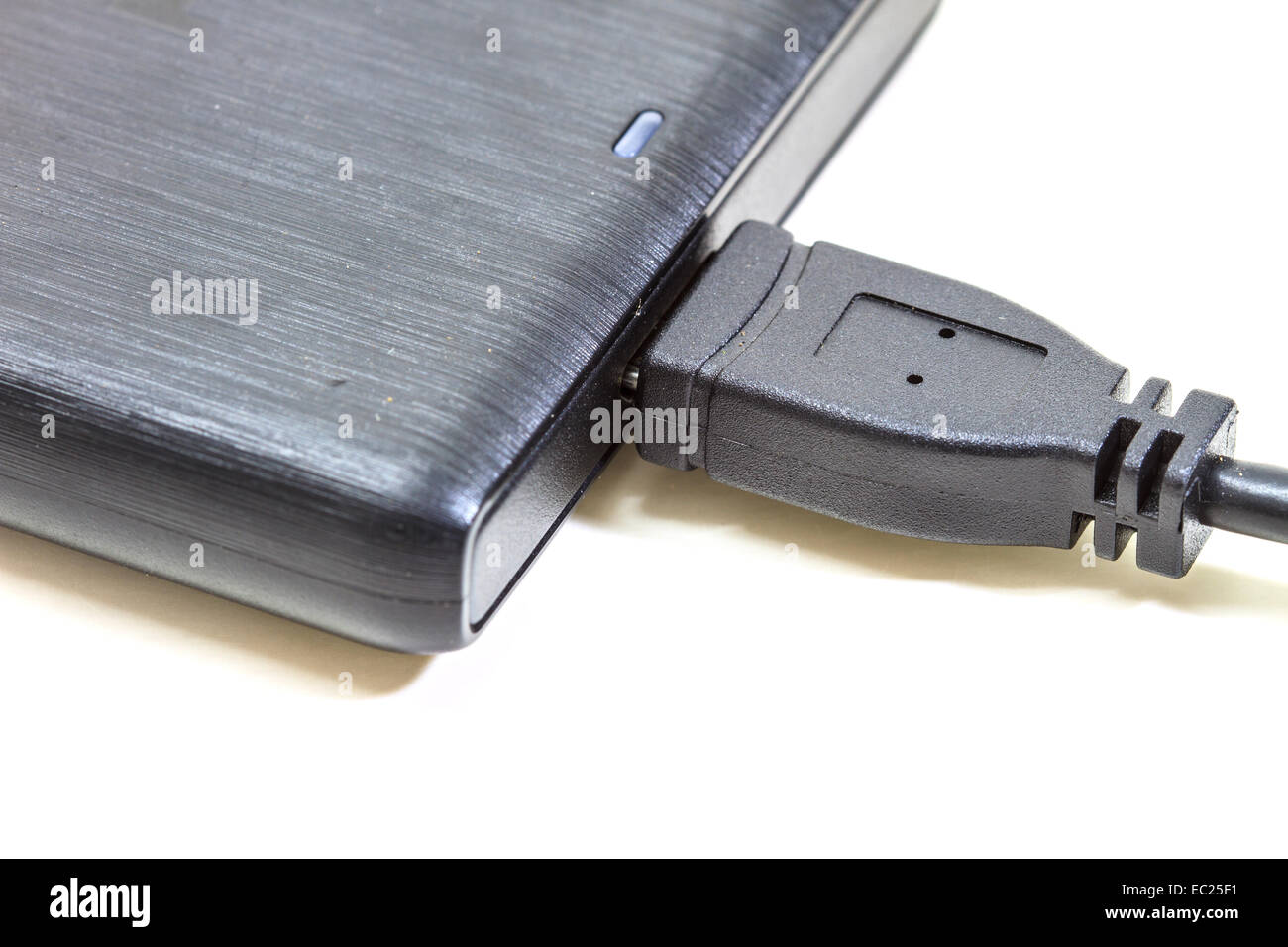 External hard drive with usb cable on white Stock Photo - Alamy