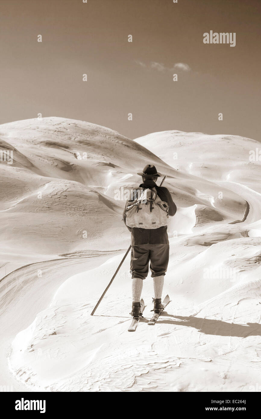 Old skier with traditional old wooden skis and backpack Stock Photo - Alamy