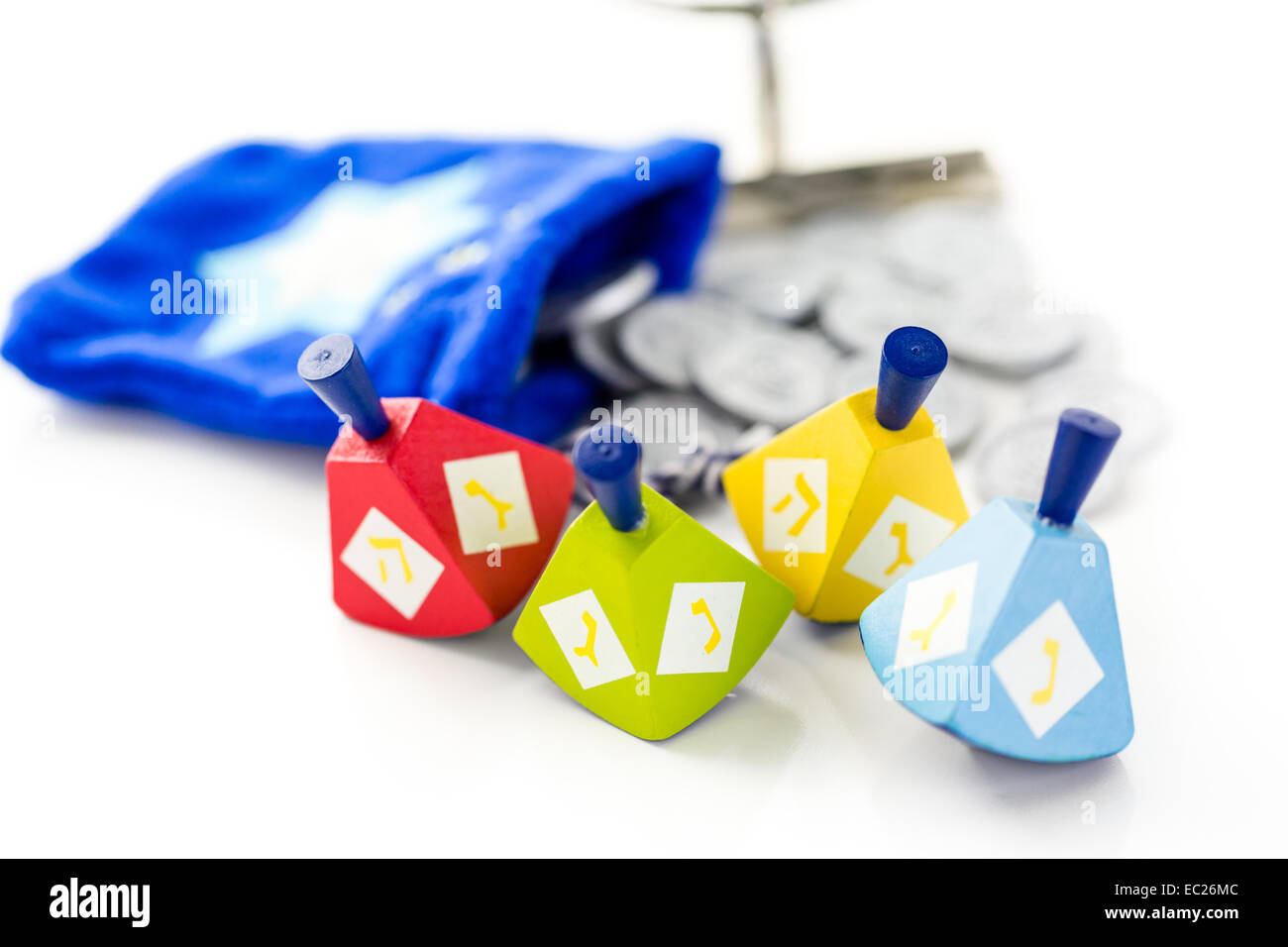 Colorful dreidels with silver tokens on a white background Stock Photo ...