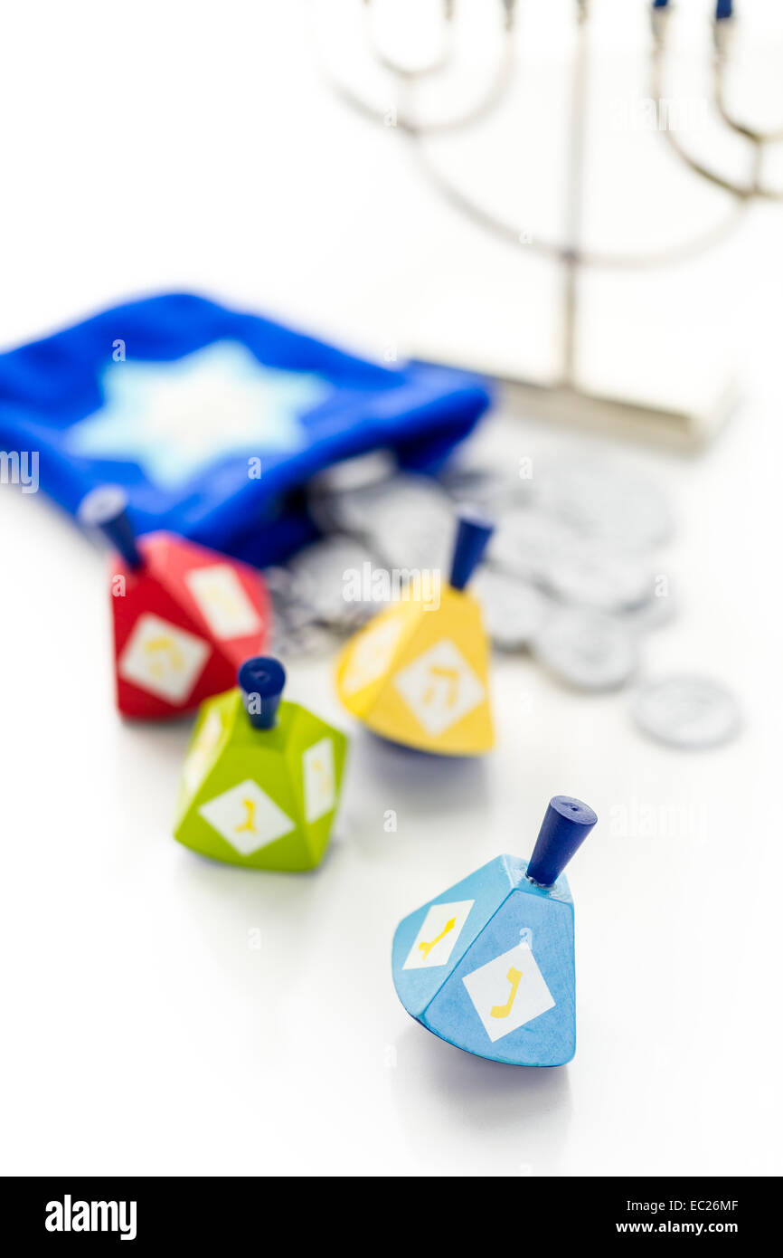 Colorful dreidels with silver tokens on a white background Stock Photo ...