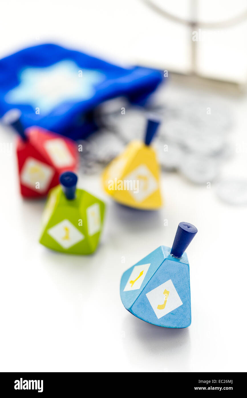 Colorful dreidels with silver tokens on a white background Stock Photo ...