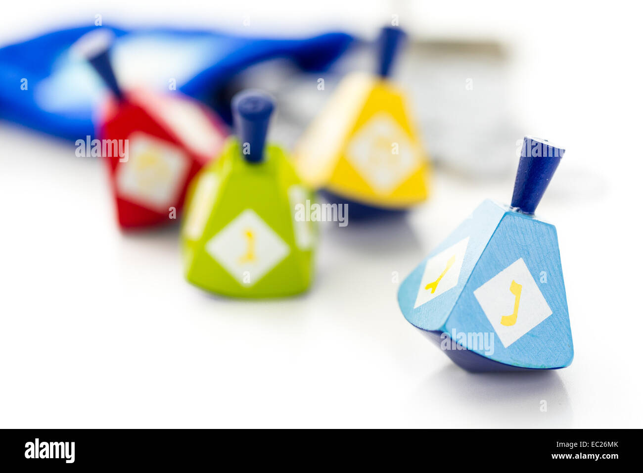 Colorful dreidels with silver tokens on a white background Stock Photo ...