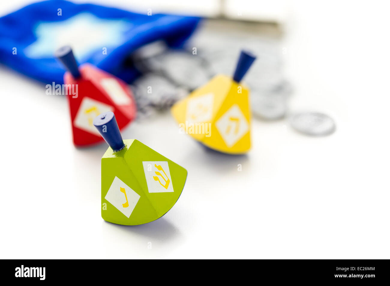 Colorful dreidels with silver tokens on a white background Stock Photo ...