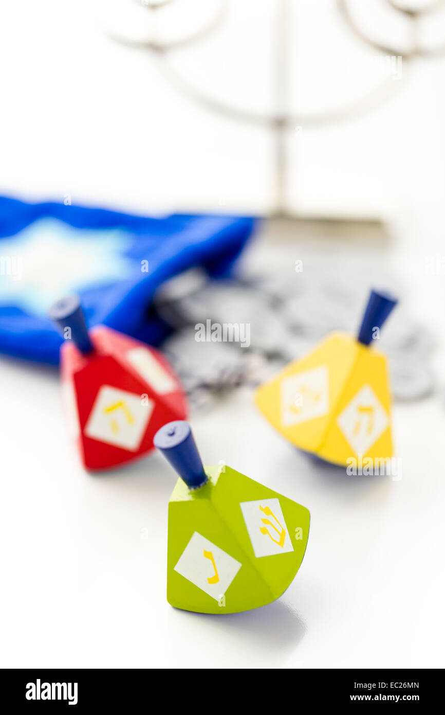 Colorful dreidels with silver tokens on a white background Stock Photo ...