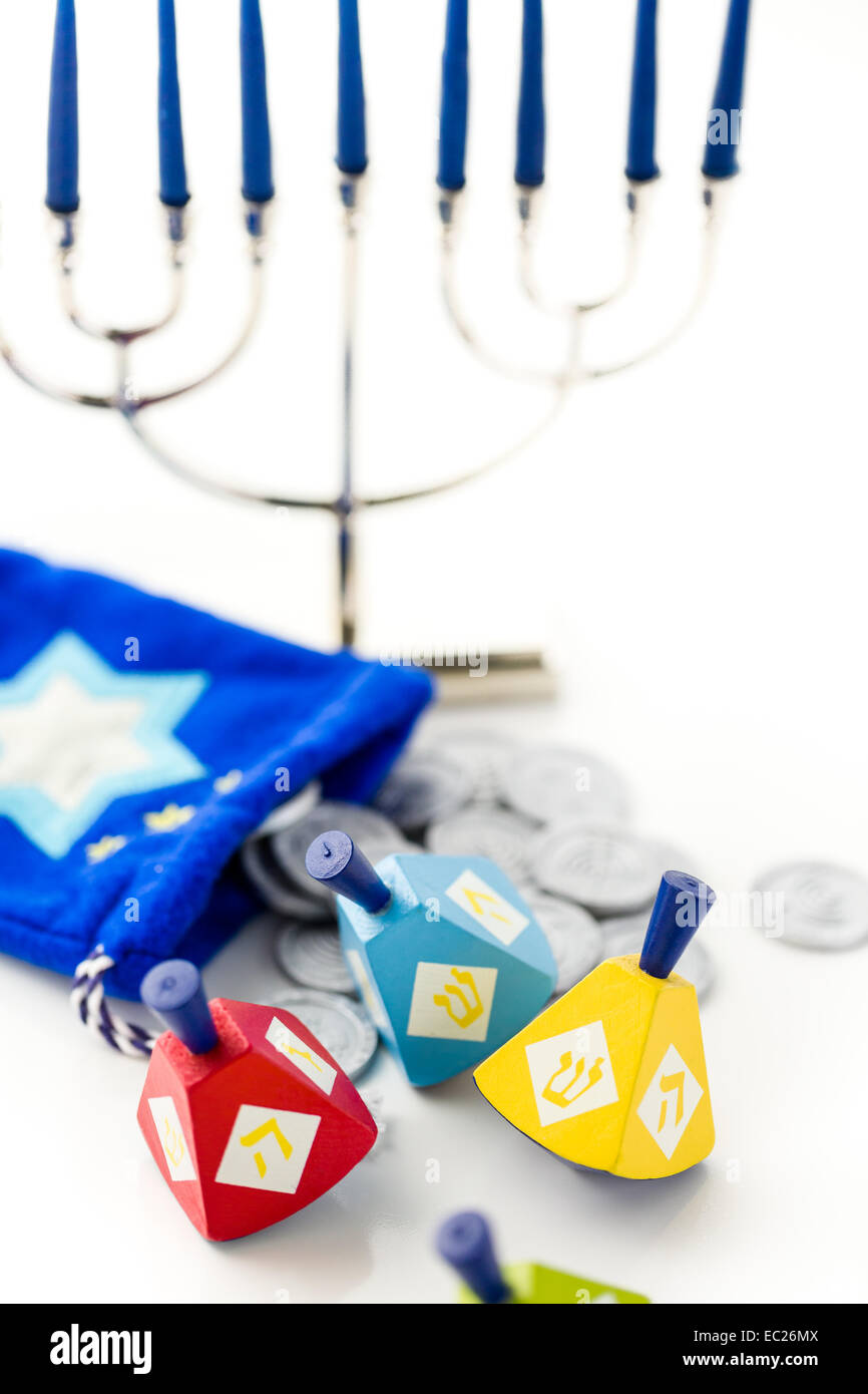 Colorful dreidels with silver tokens on a white background Stock Photo ...