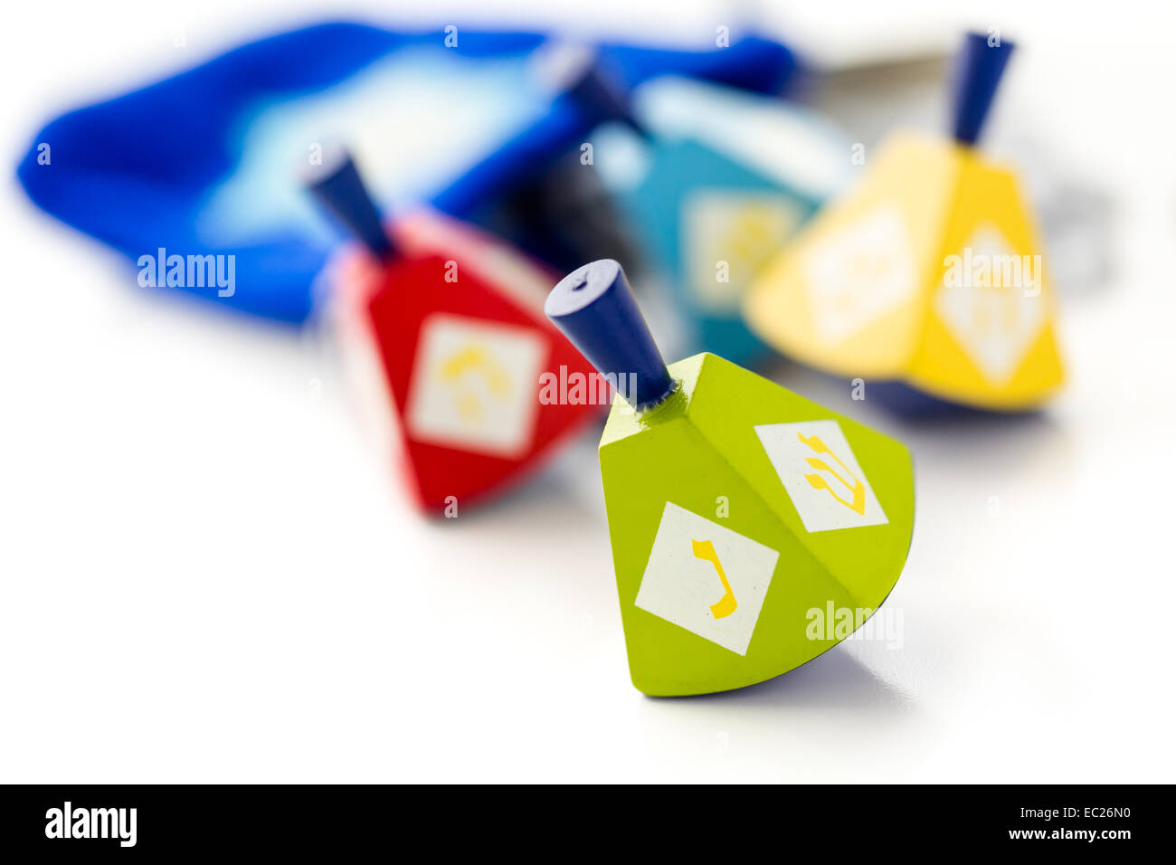 Colorful dreidels with silver tokens on a white background Stock Photo ...