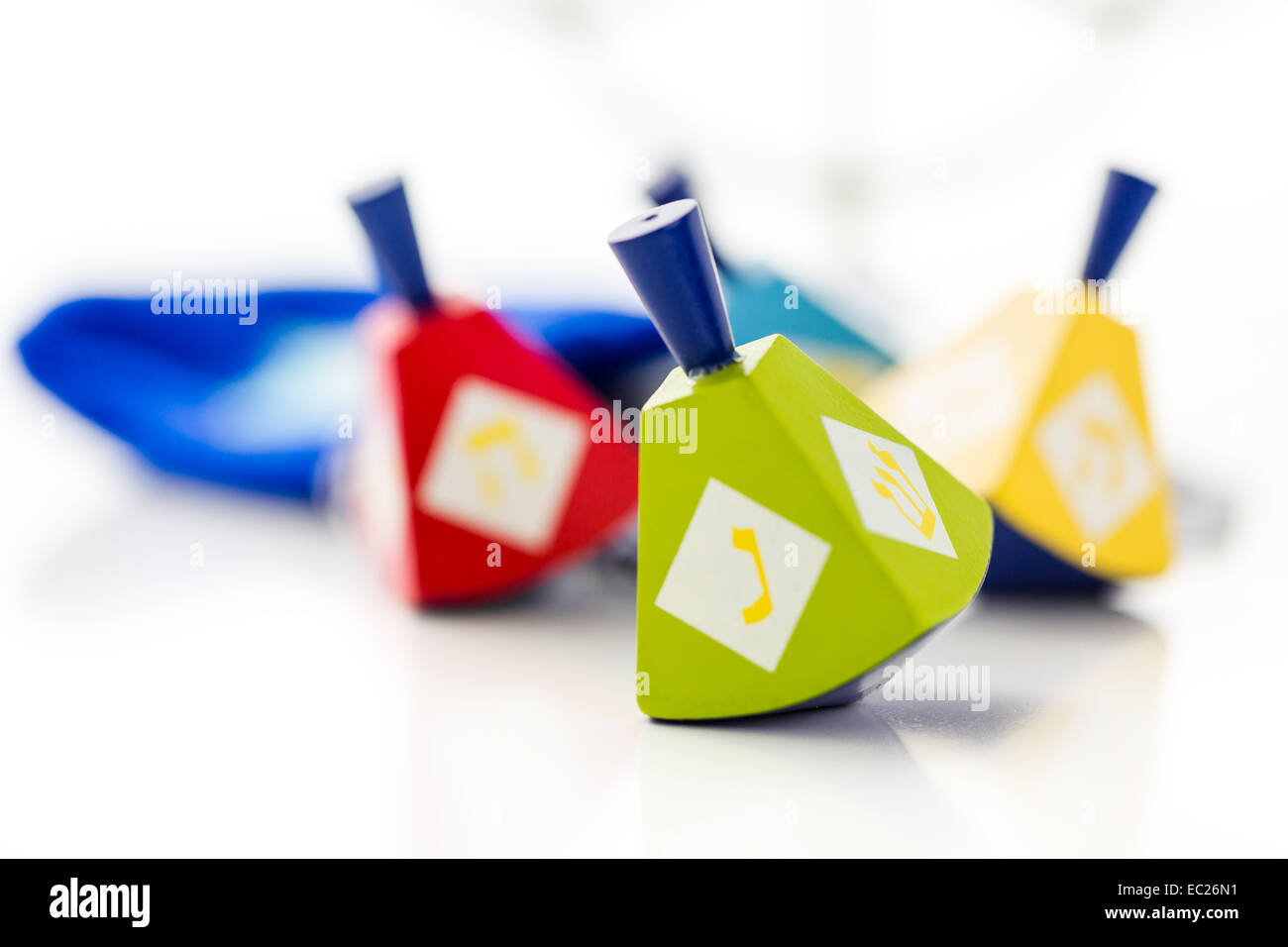 Colorful dreidels with silver tokens on a white background Stock Photo ...