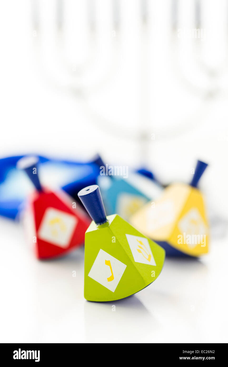 Colorful dreidels with silver tokens on a white background Stock Photo ...