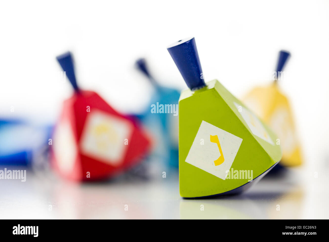 Colorful dreidels with silver tokens on a white background Stock Photo ...