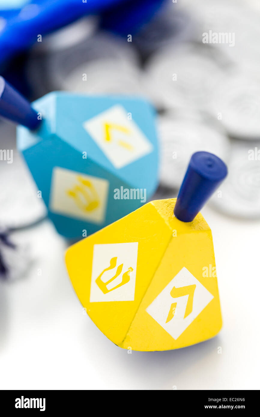 Colorful dreidels with silver tokens on a white background Stock Photo ...