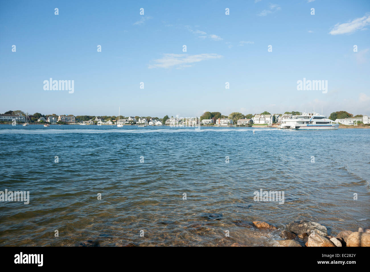 Across Cape cod Harbor, with traditional architecture Stock Photo - Alamy