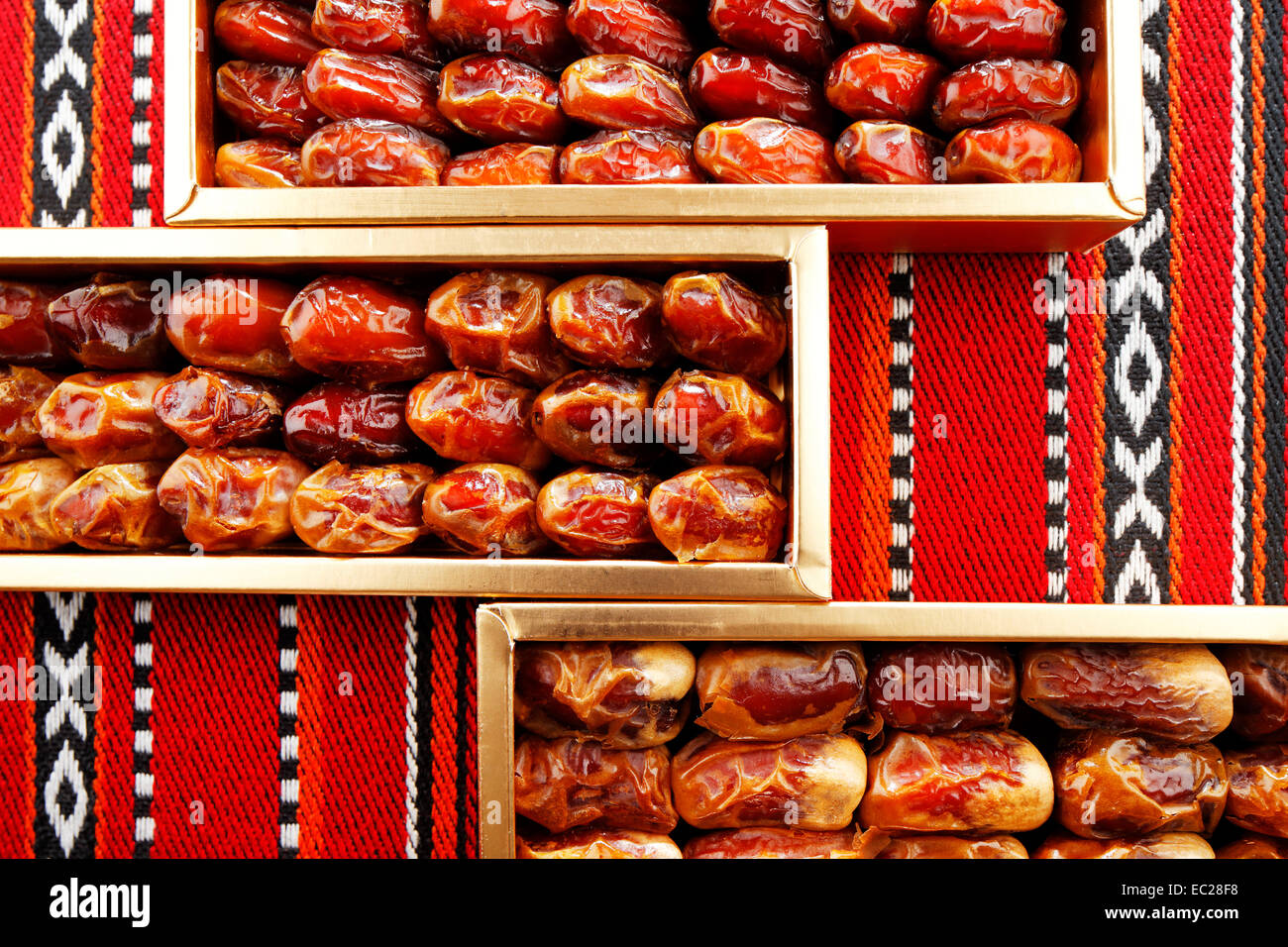 Dates arranged on Arabian woven fabric. Dates symbolise Arabian ...
