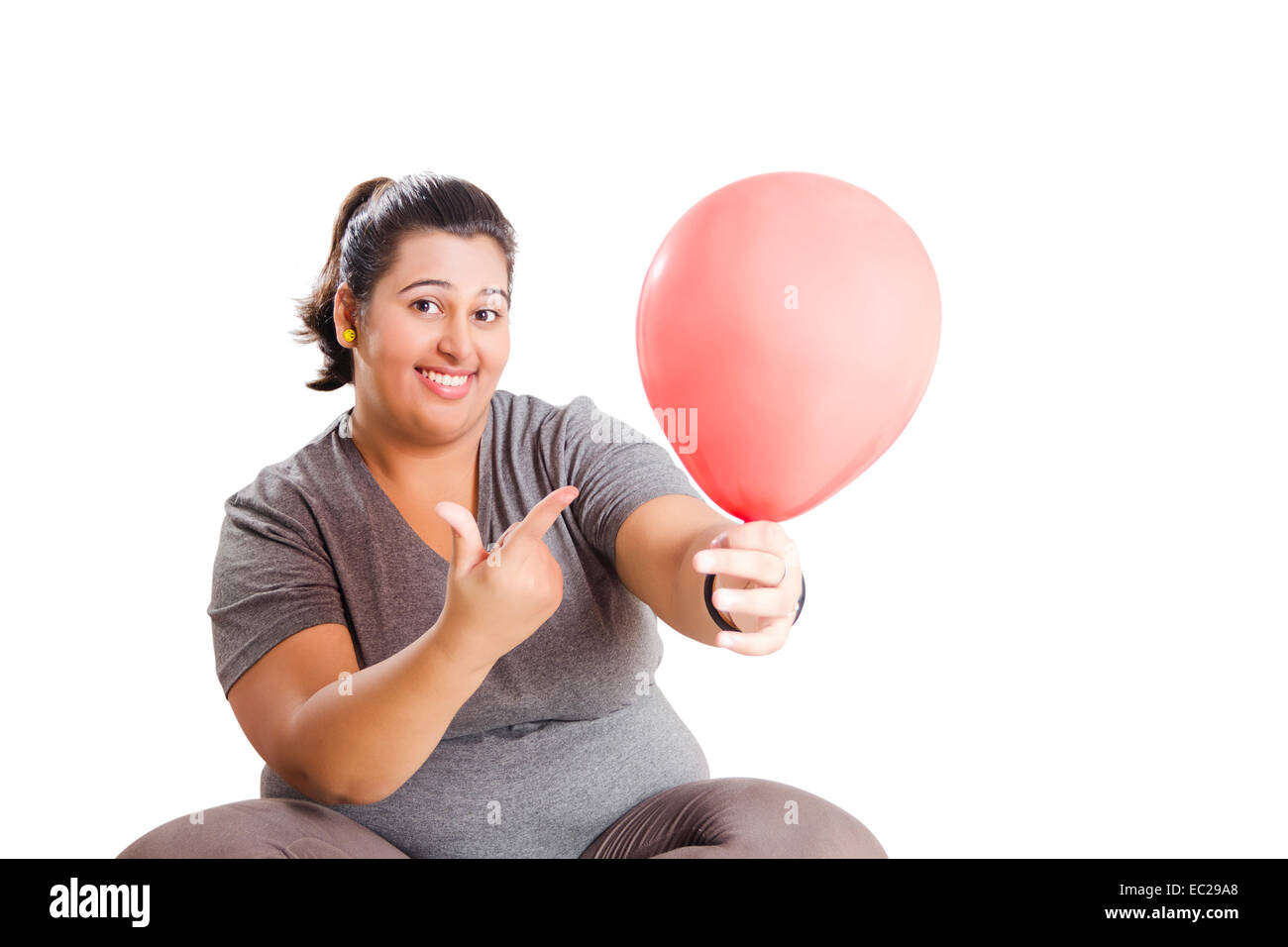 indian Obese Lady giving Balloon Stock Photo - Alamy
