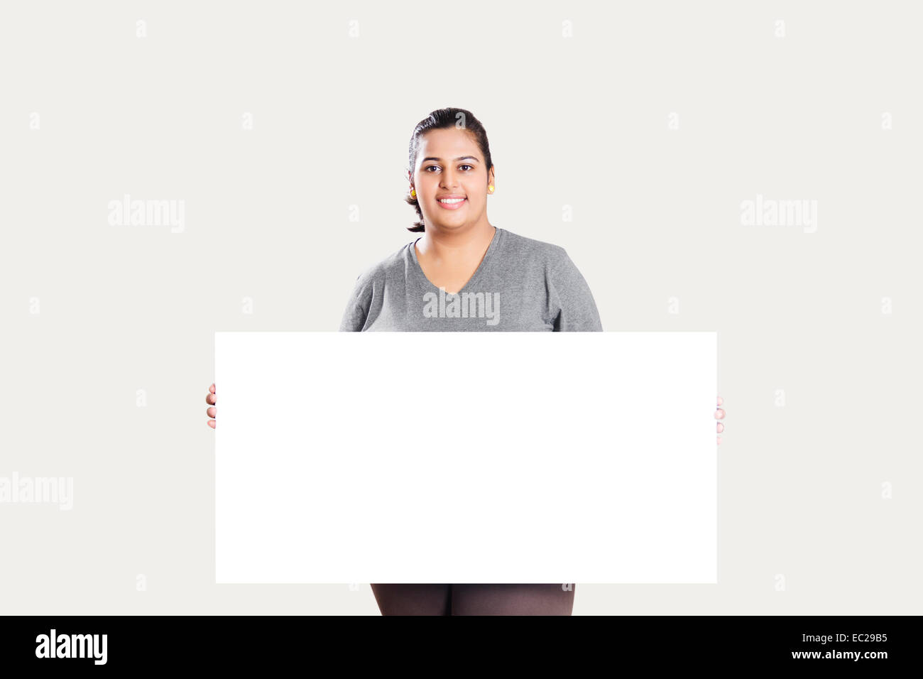 indian Obese Lady Showing Message Board Stock Photo - Alamy