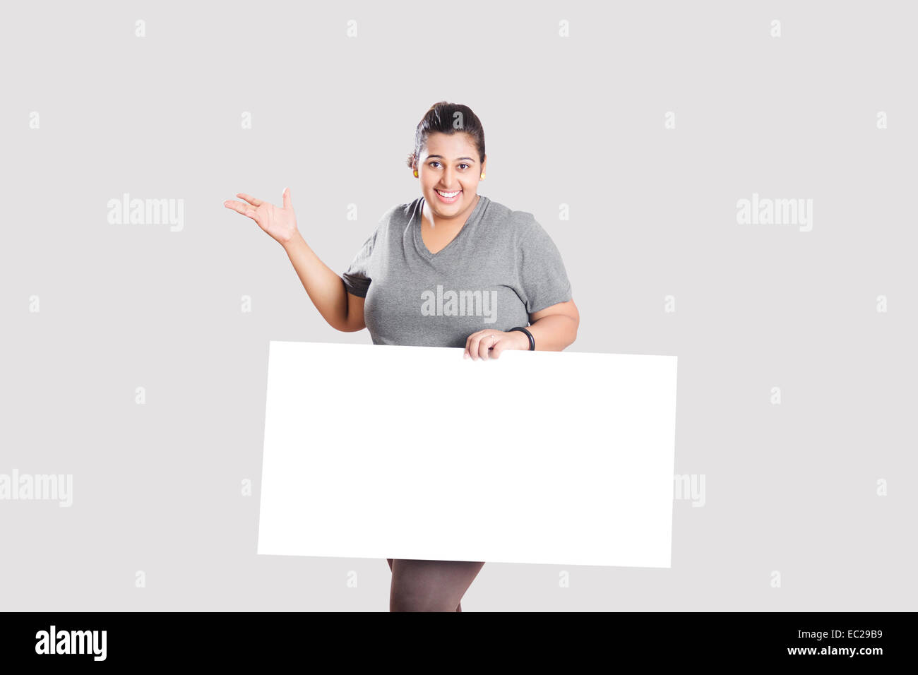 indian Obese Lady Showing Message Board Stock Photo - Alamy
