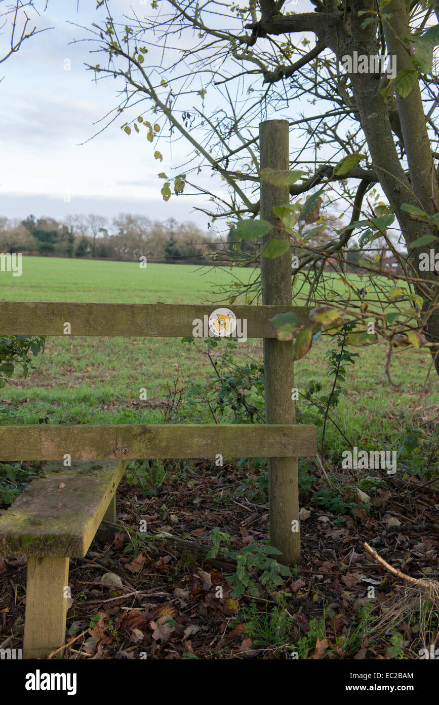 Foot path sign and stile field corner Stock Photo - Alamy
