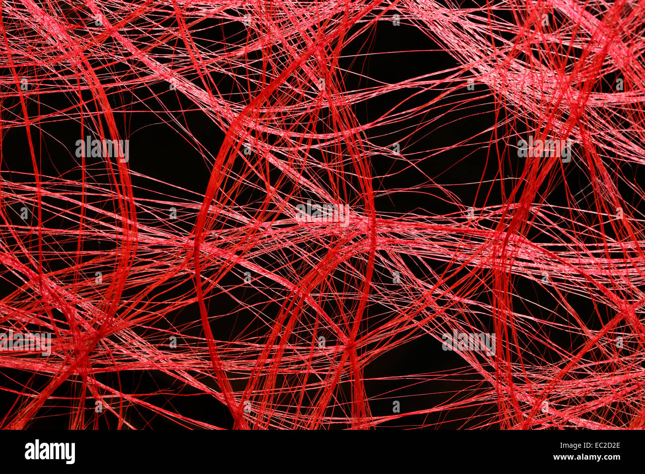 Red net textile on black Stock Photo - Alamy