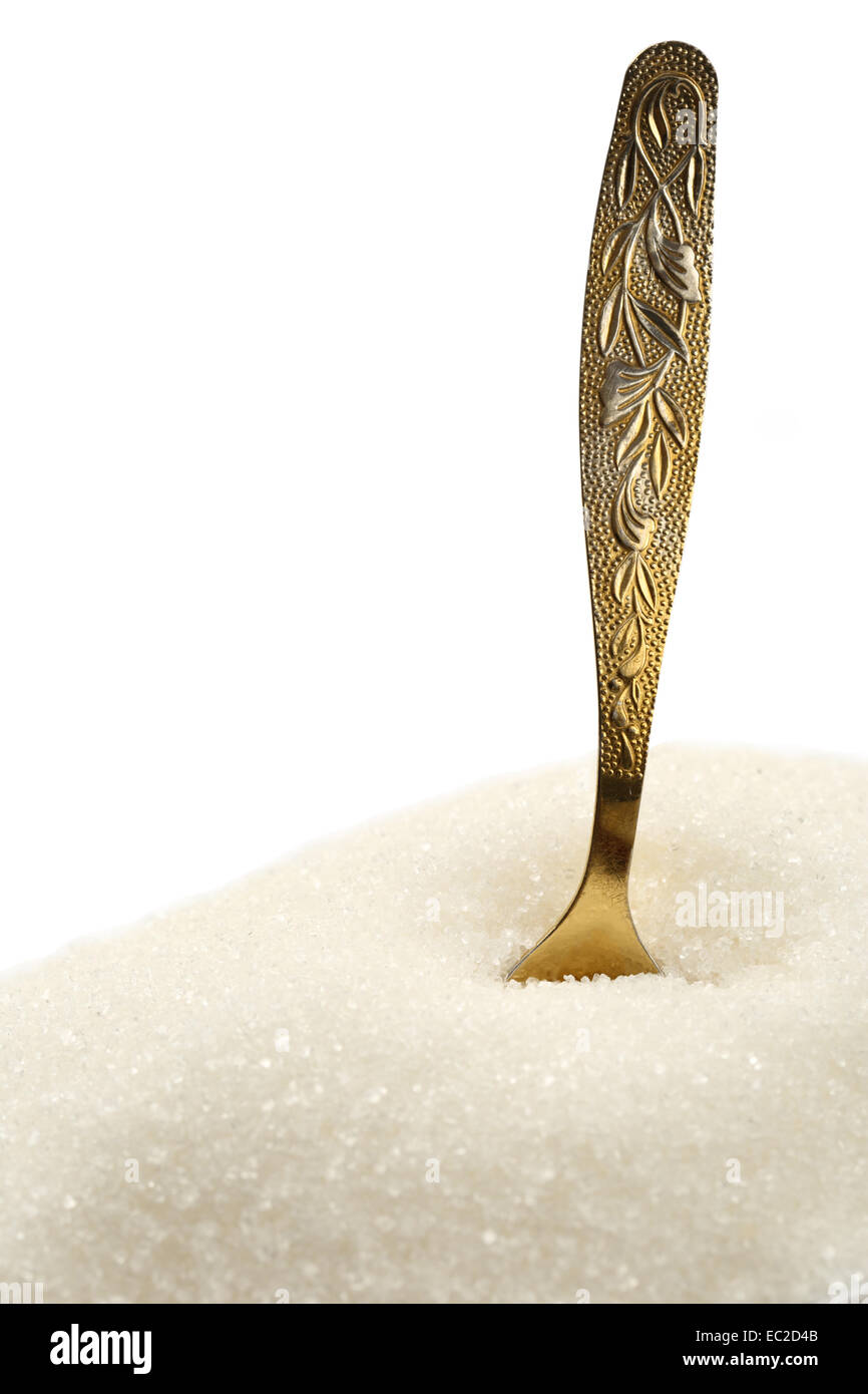 Heap of white sugar and spoon Stock Photo - Alamy