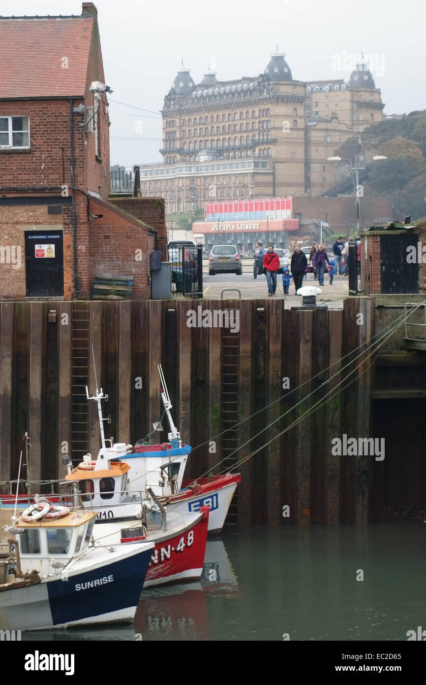 View of the Grand Hotel through buildings surrounding the harbour and ...