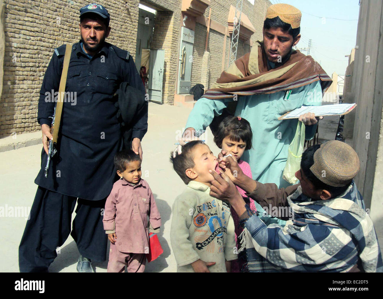 Health worker administrates polio-vaccine drops to a child during anti ...