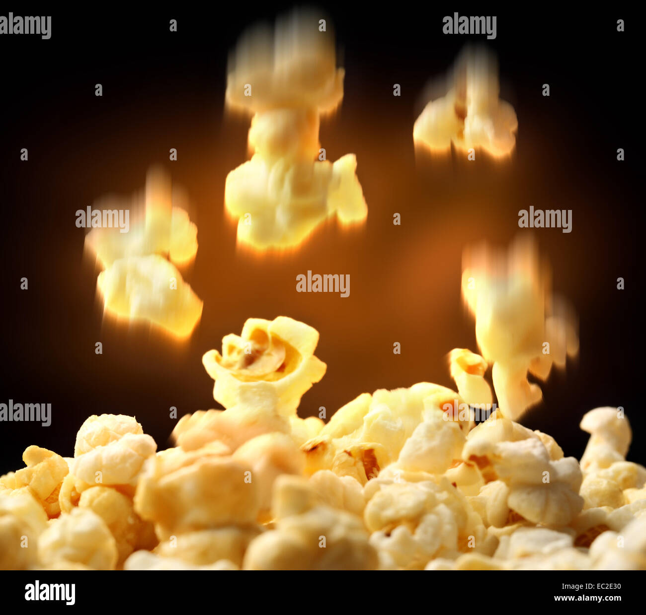 Popcorn falling down on black background Stock Photo - Alamy