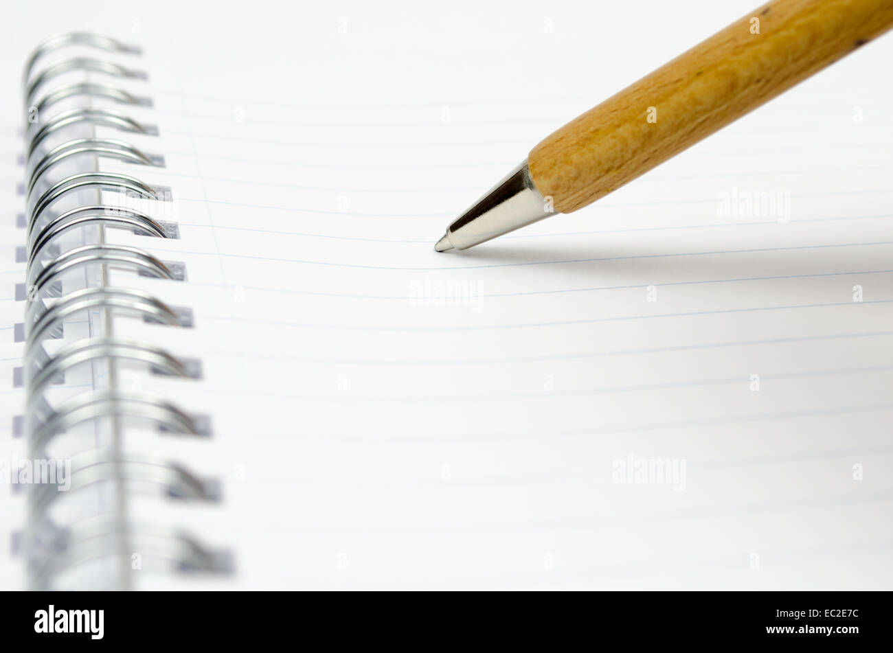 Spiral notebook and pen Stock Photo - Alamy