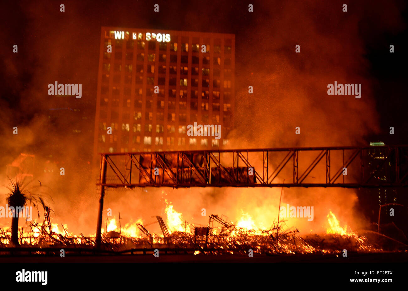 Over 250 firefighters battle the fire and also debris from the ...