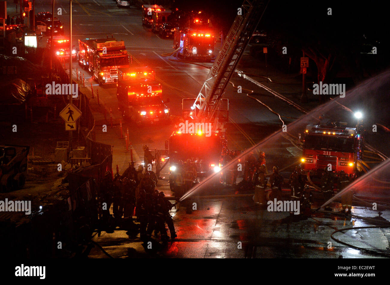 Over 250 firefighters battle the fire and also debris from the ...