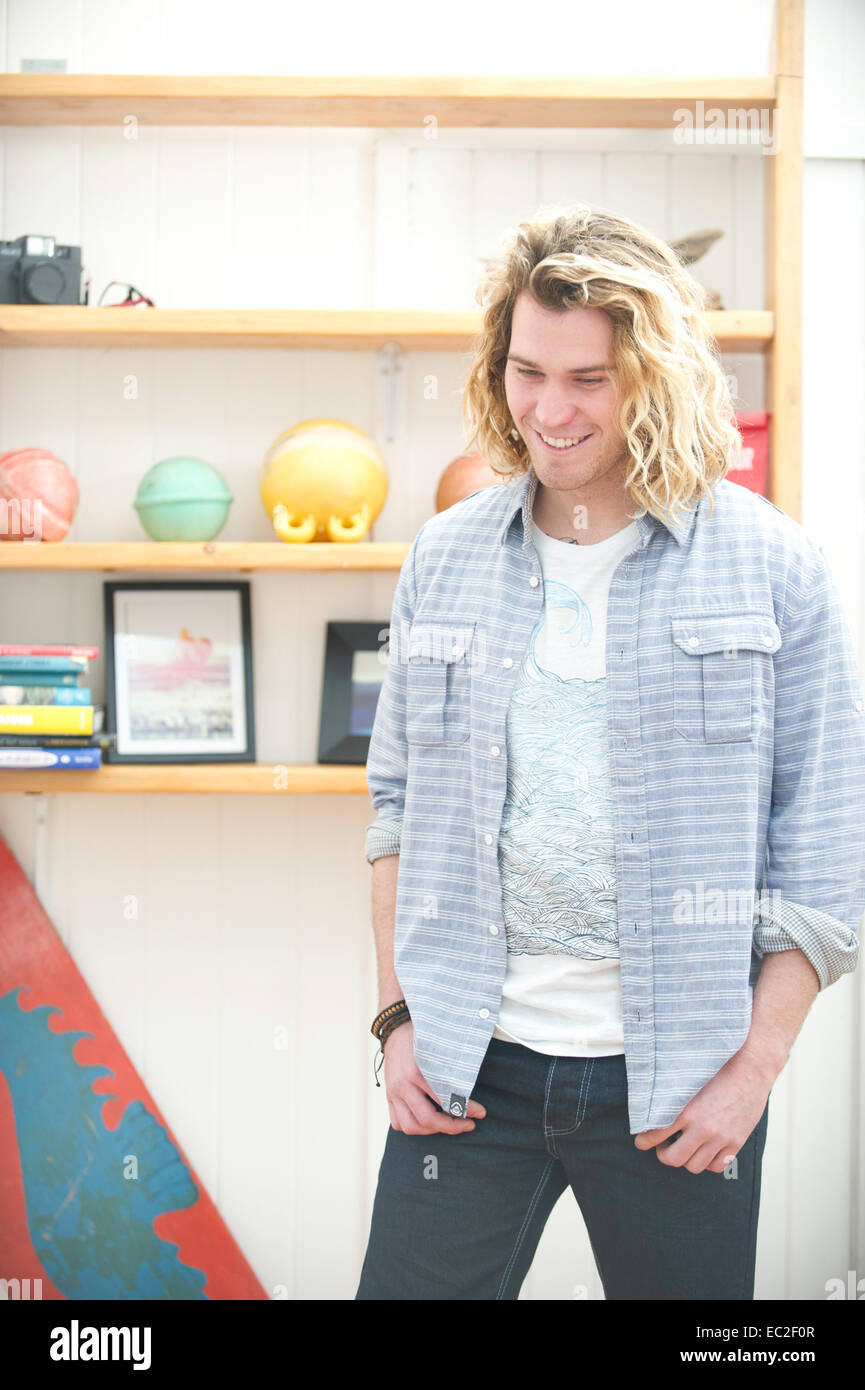 A cool surfer dude indoors Stock Photo - Alamy