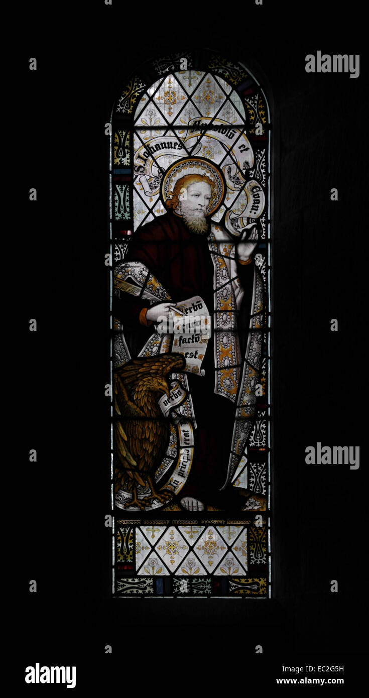 A stained glass window by the Kempe Studios depicting St John, St Mary ...
