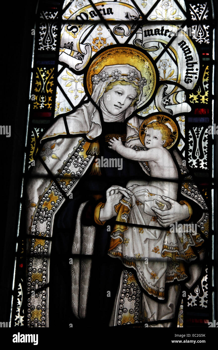 A stained glass window by the Kempe Studios depicting Madonna & Child ...