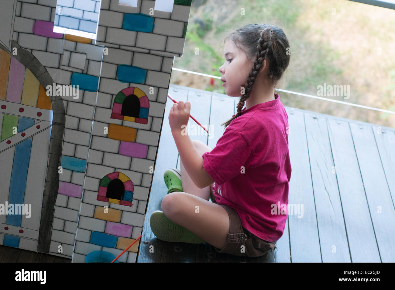 Child painting castle Stock Photo - Alamy