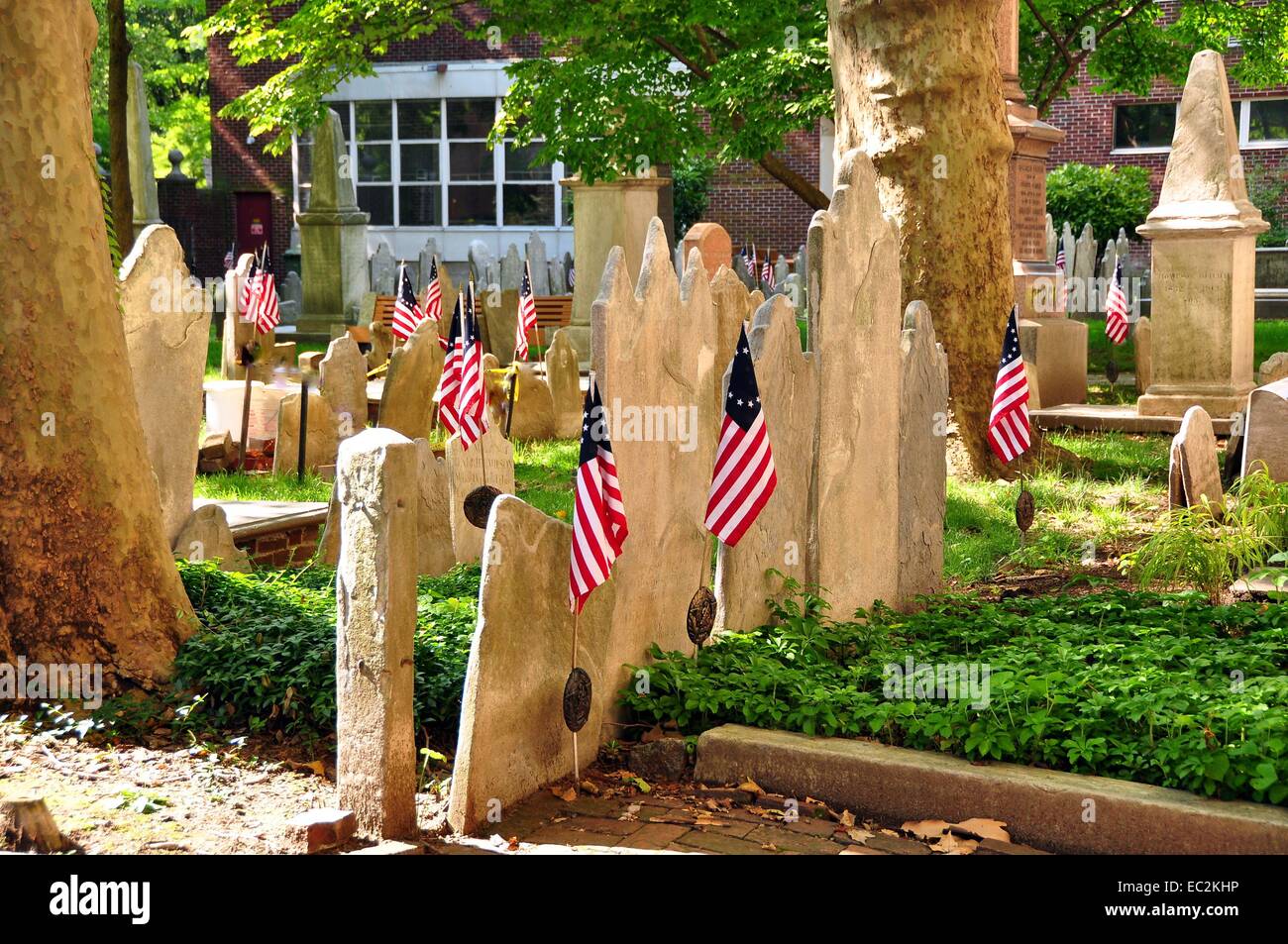 PHILADELPHIA, PENNSYLVANIA: Rows of old graves, many decorated with ...