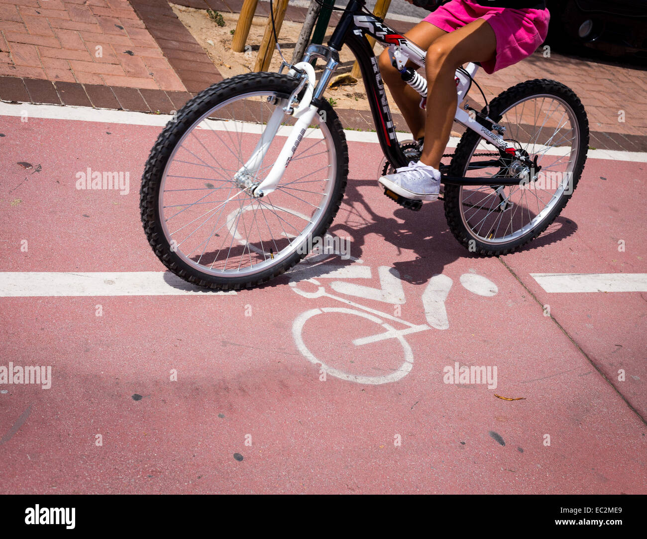 A tanned cyclist on a cycle path in Fuengirola Stock Photo - Alamy