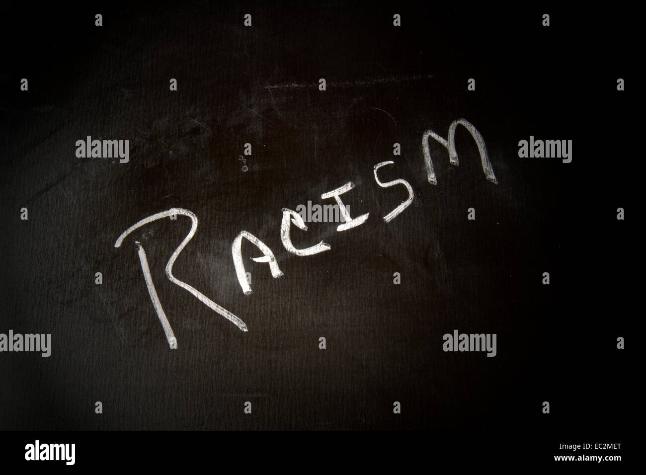 Light shining on the word RACISM on a chalkboard Stock Photo - Alamy