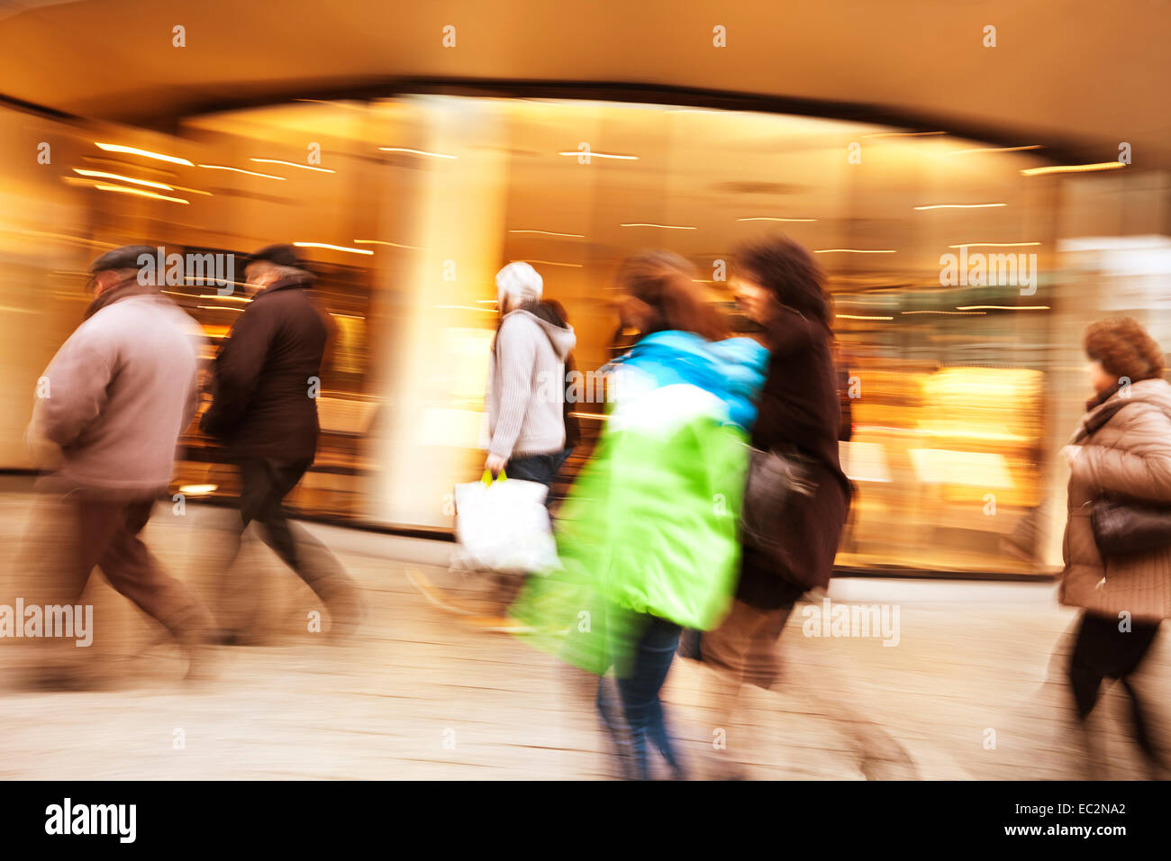 A shopper walking in front of shop window Stock Photo - Alamy