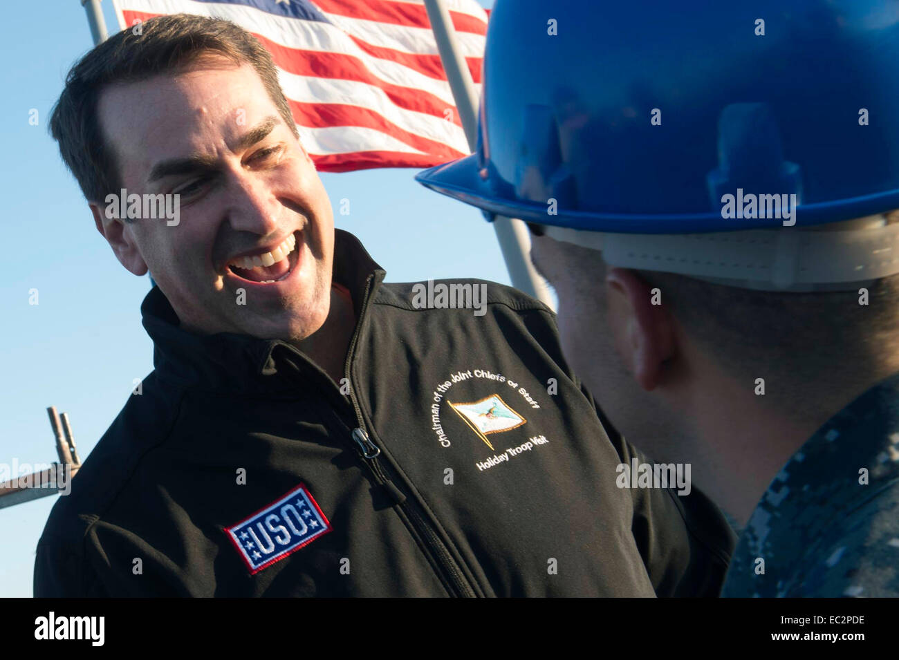 Actor and comedian Rob Riggle greets a sailor during a holiday visit to ...