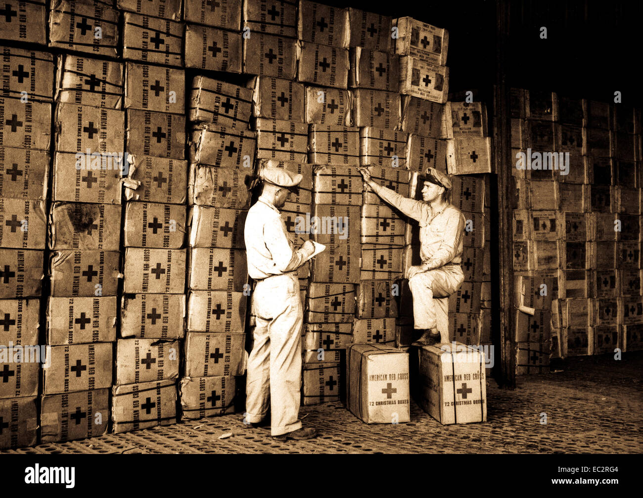 Red Cross field men preparing to ship gift boxes to servicemen fighting ...