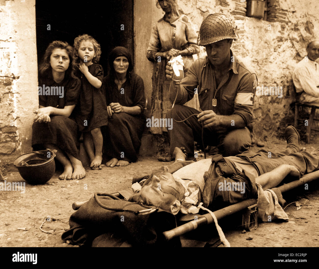 Private Roy Humphrey of Toledo, Ohio, is being given blood plasma by ...