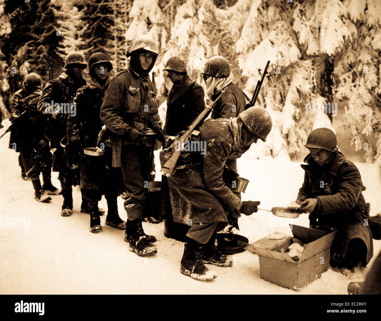 Chow is served to American Infantrymen on their way to La Roche ...