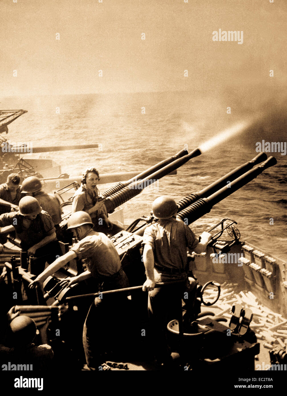Task Force 58 raid on Japan. 40mm guns firing aboard USS HORNET on 16 ...