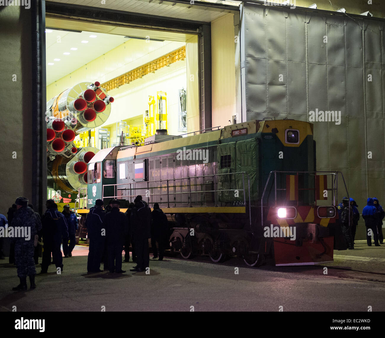 The Soyuz rocket, carrying Expedition 42 crew members, is rolled out to ...