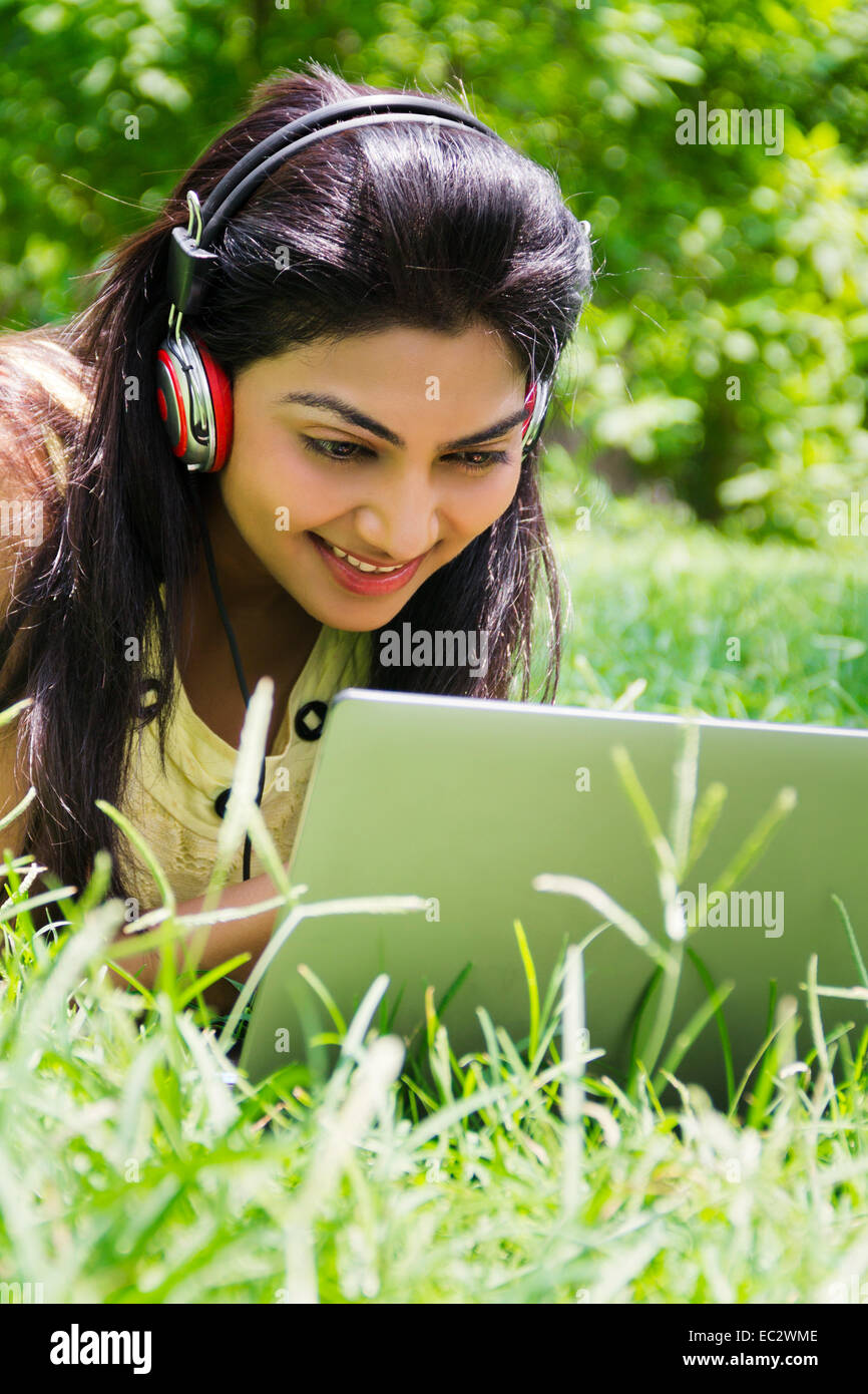 indian Beautiful lady park Hearing Music Stock Photo - Alamy