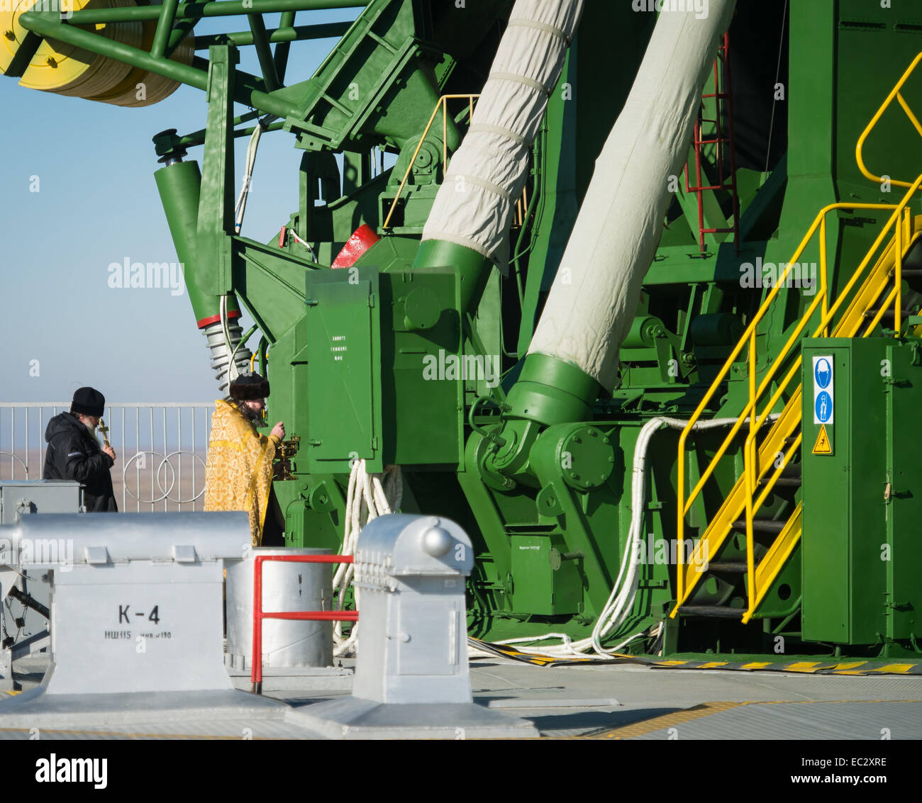 An Orthodox priest blesses the Soyuz rocket at Baikonur Cosmodrome in ...