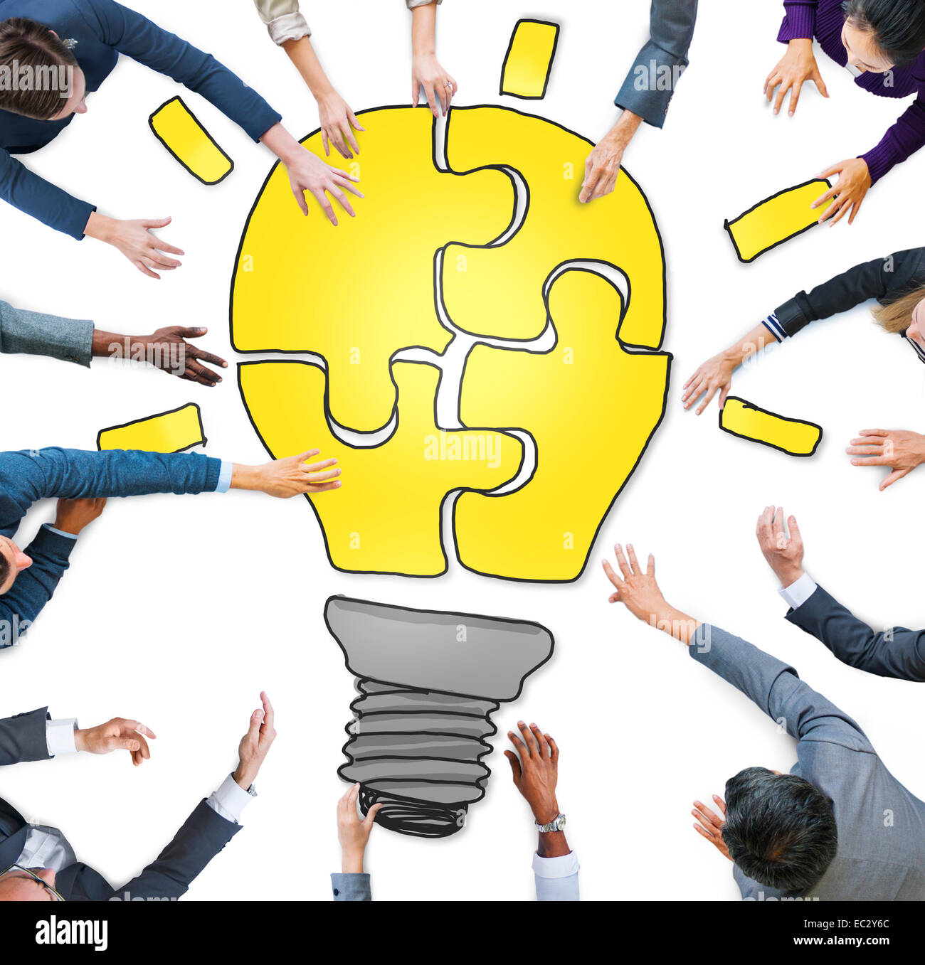 Business People Forming a Light Bulb Puzzle Stock Photo - Alamy