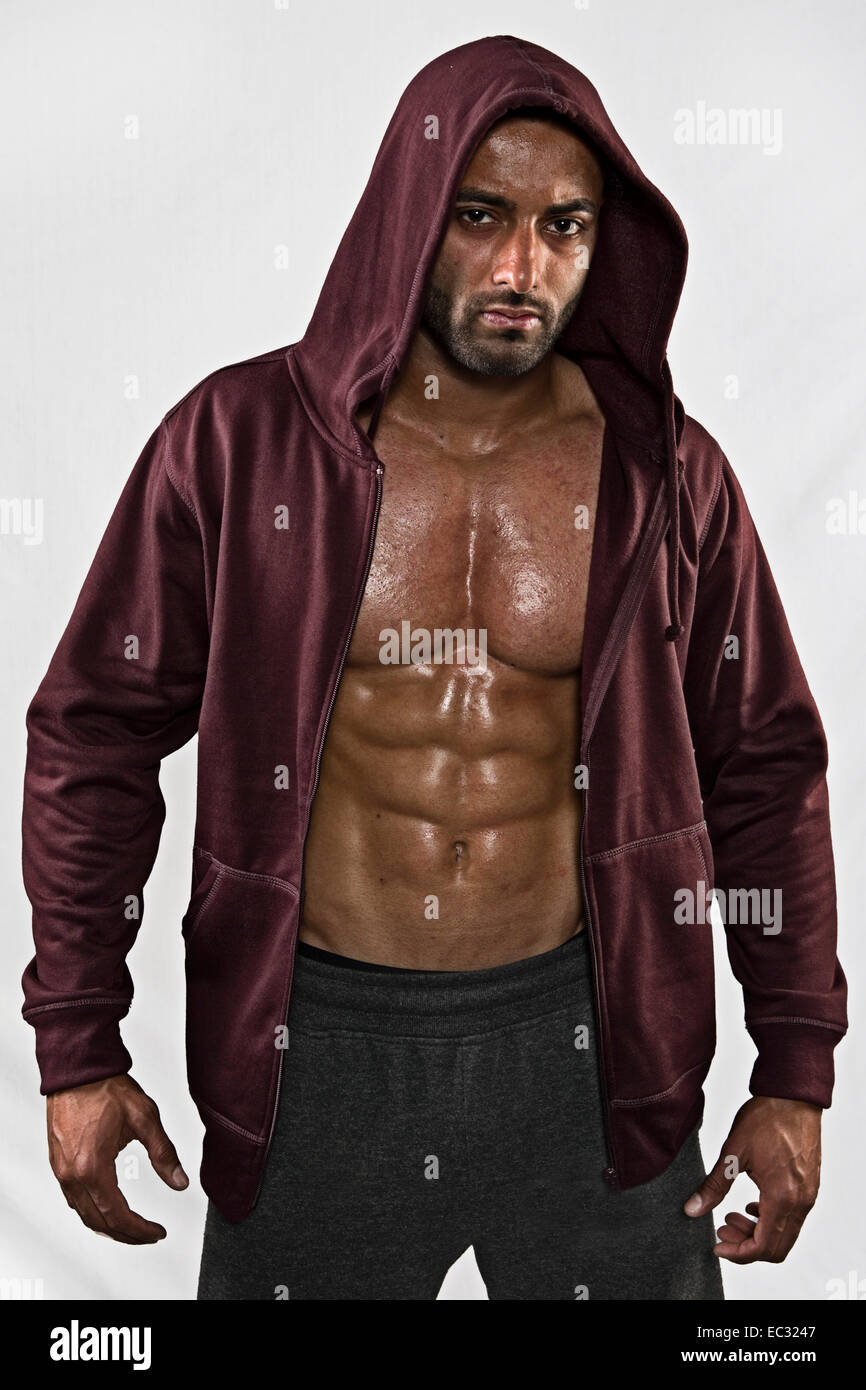 young male wearing open hoody showing muscular chest Stock Photo - Alamy