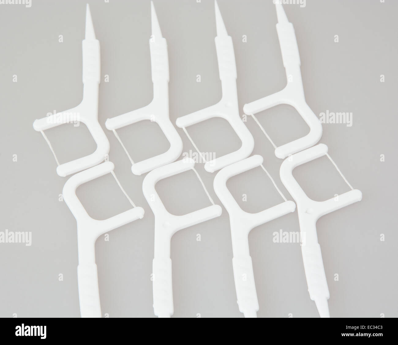 White dental floss sticks stored in a geometric shape Stock Photo - Alamy